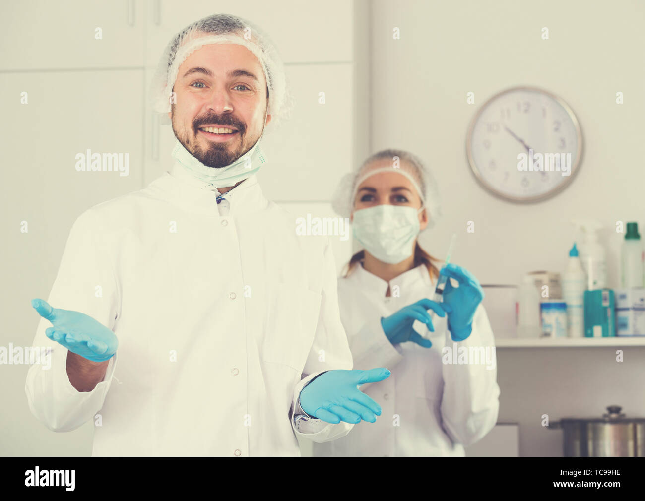 Female nurse and male doctor expecting patients in office Stock Photo ...