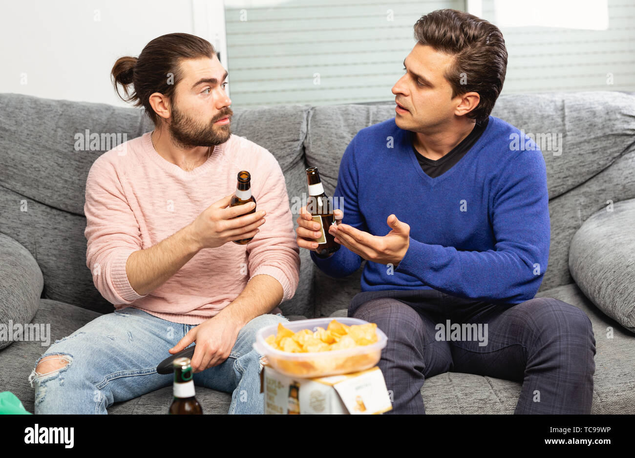 Two guys drinking beer on hi-res stock photography and images - Alamy