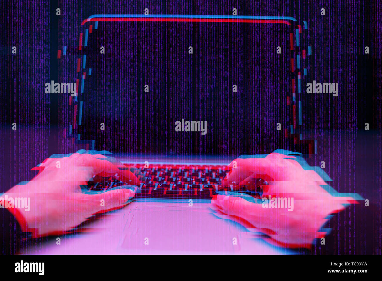 Hacker working with laptop in dark room with digital interface around ...