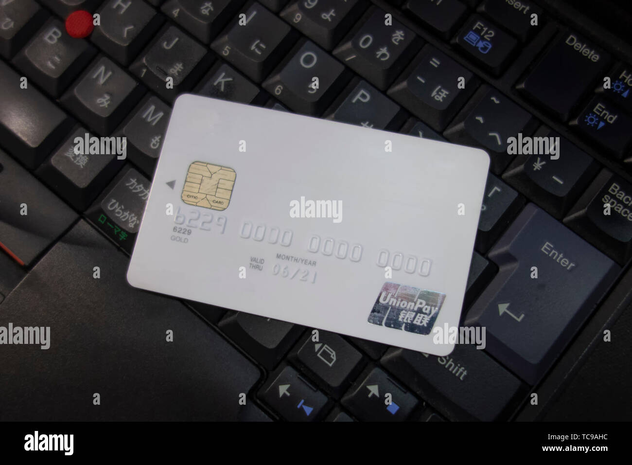 A credit card on a laptop keyboard Stock Photo - Alamy