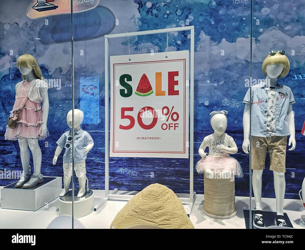 Children's clothing shop window Stock Photo - Alamy