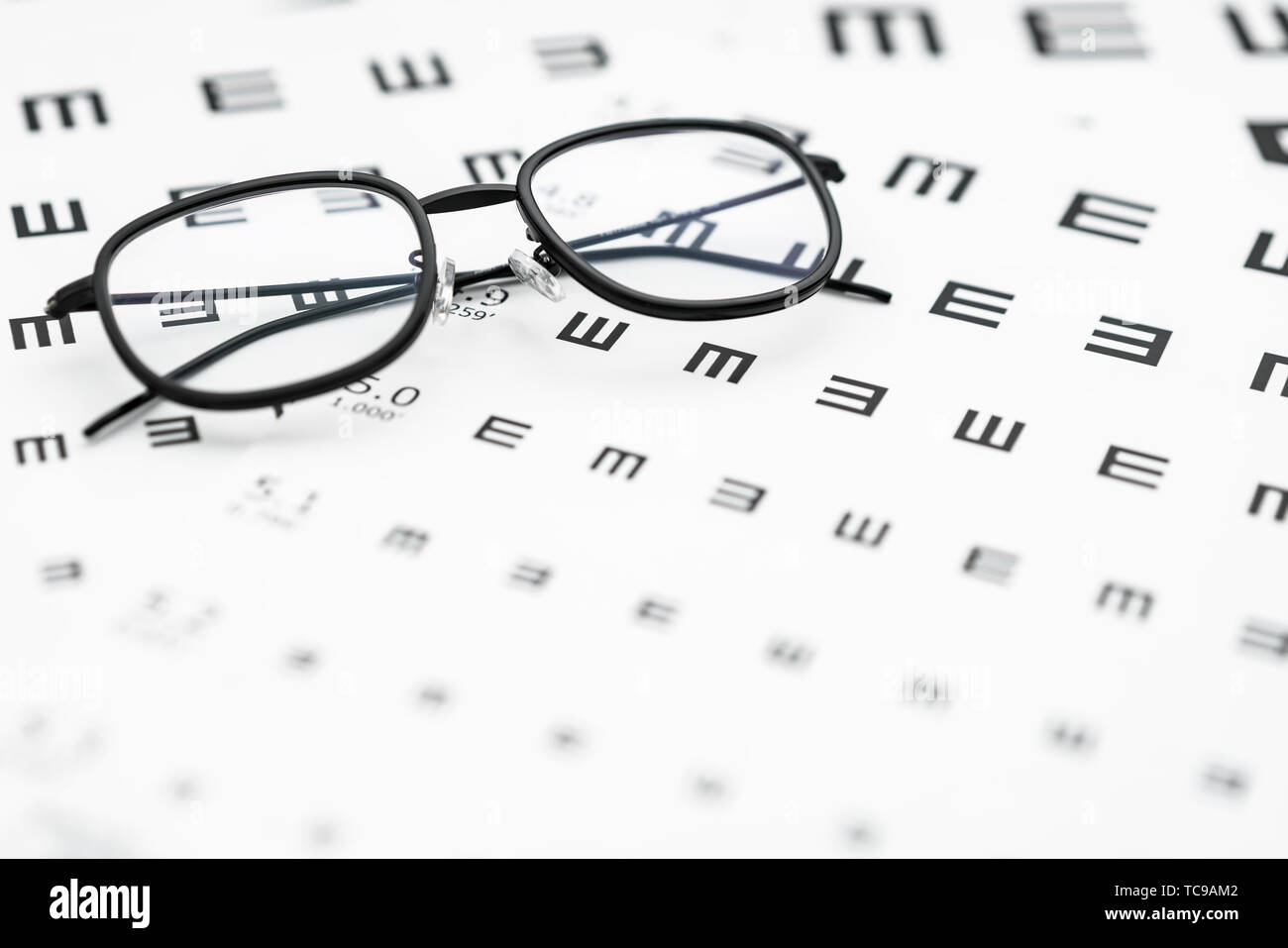 Black glasses and visual meter on white background Stock Photo - Alamy