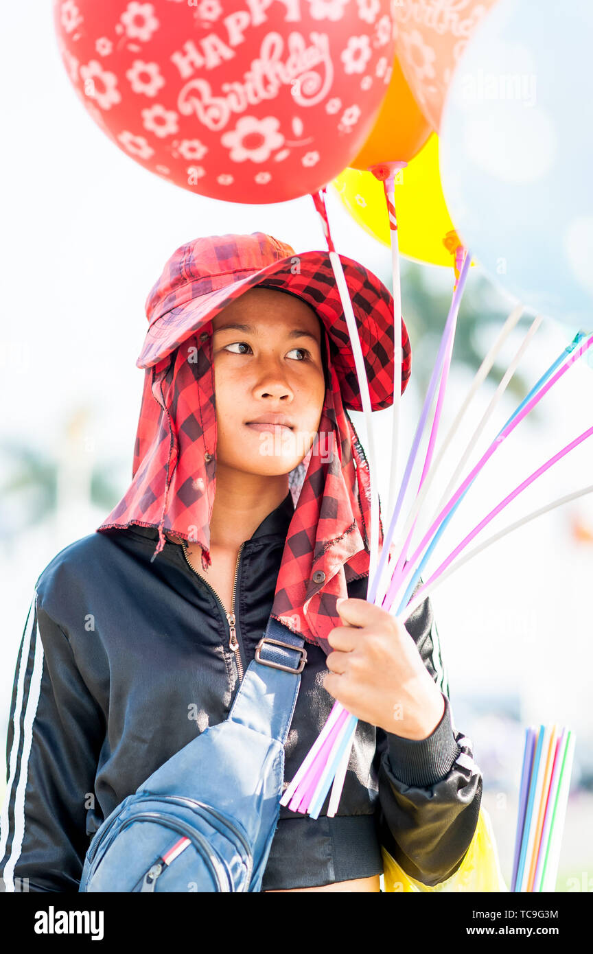 Girl selling balloons hi-res stock photography and images - Alamy
