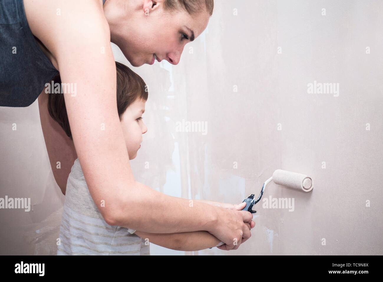 Boy Helping Mother With Chores High Resolution Stock Photography and Images - Alamy