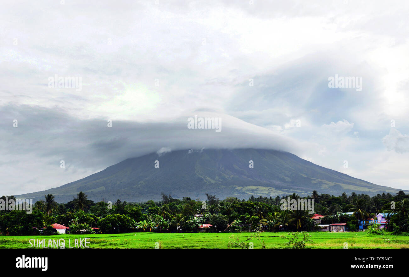 The Mayon volcano covered with a beautiful cloud Stock Photo - Alamy