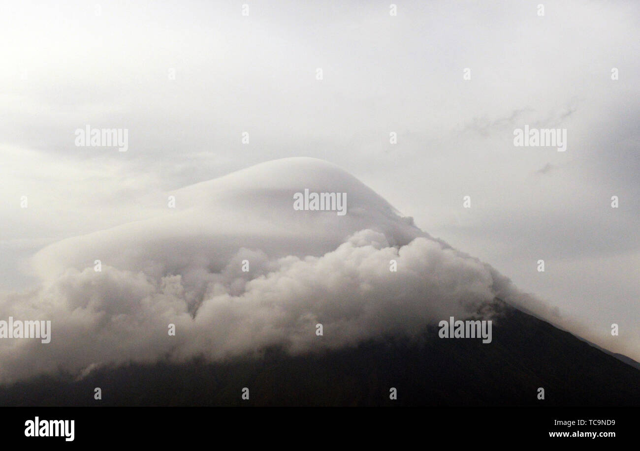 The Mayon volcano covered with a beautiful cloud Stock Photo - Alamy