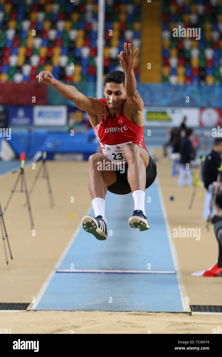 ISTANBUL, TURKEY - FEBRUARY 16, 2019: Undefined athlete long jumping ...