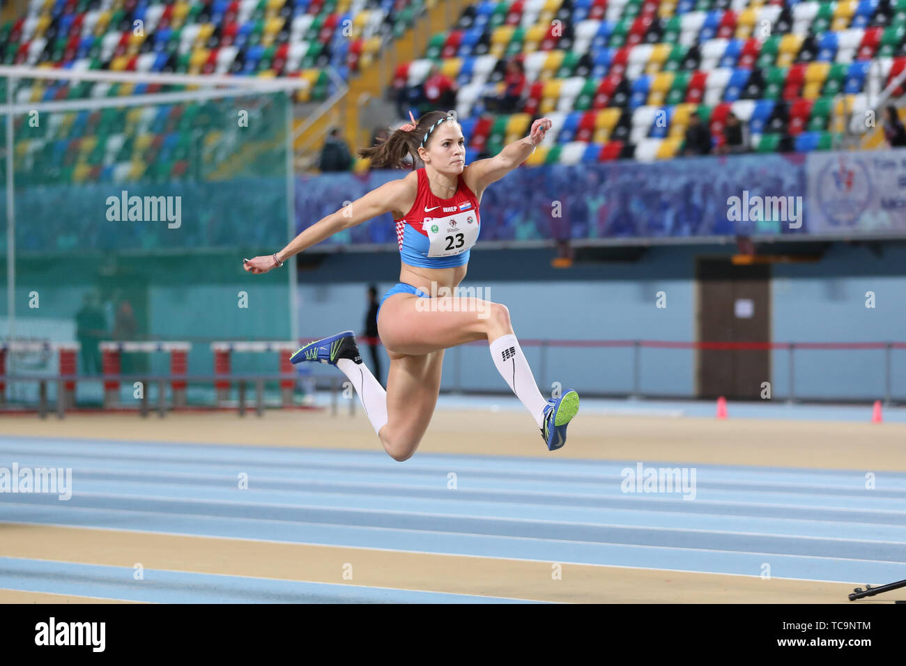 ISTANBUL, TURKEY - FEBRUARY 16, 2019: Undefined athlete triple jumping ...