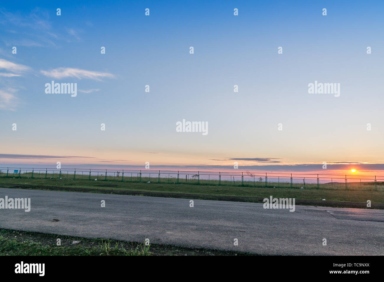 Prairie road background at sunrise and sunset Stock Photo - Alamy