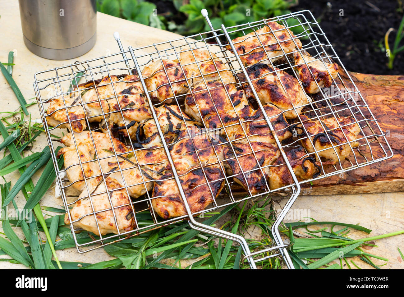 Cooking meat on fire. Fry meat on metal grid. Barbecue on nature for ...