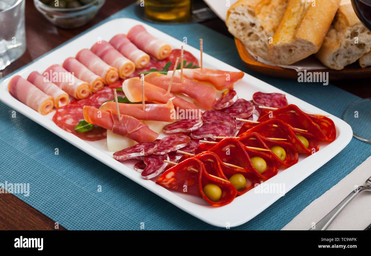 Cold smoked meat plate with traditional Spanish chorizo, fuet and ...