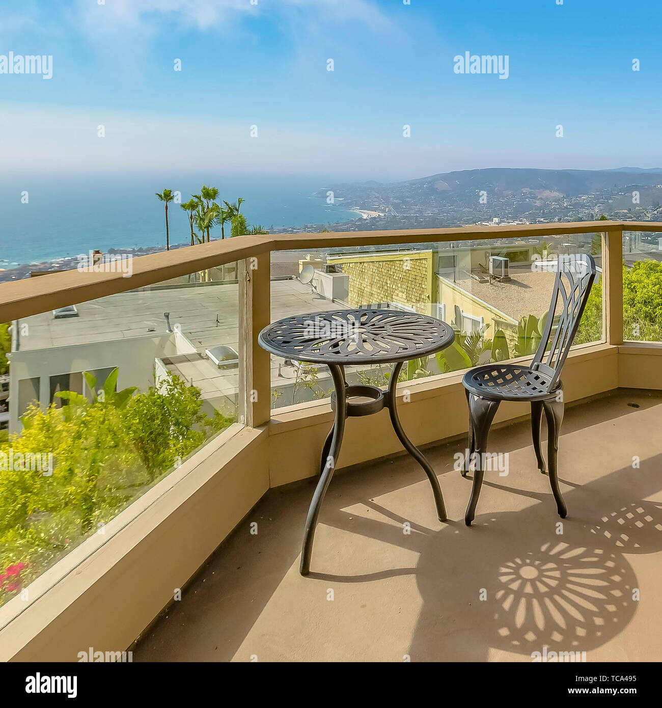Square Balcony overlooking the lake and valley under bright blue sky on ...