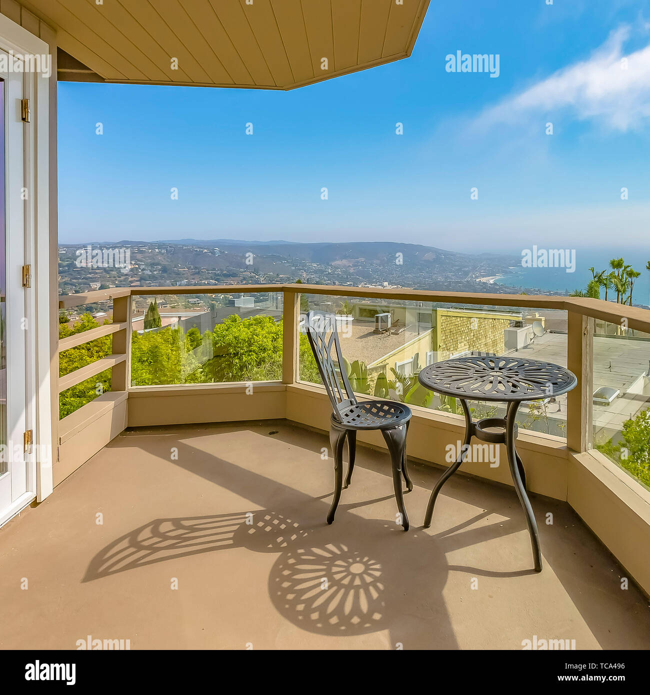 Frame Square Balcony overlooking the lake and valley under bright blue ...