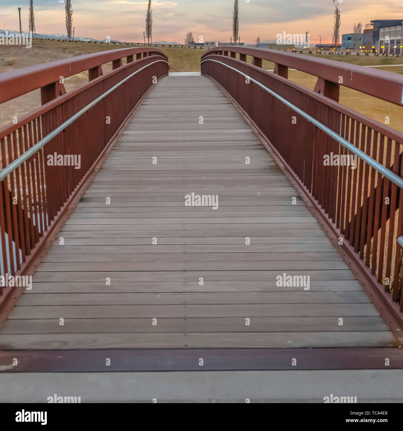 Frame Square Close up of a bridge with a wooden deck and brown metal ...