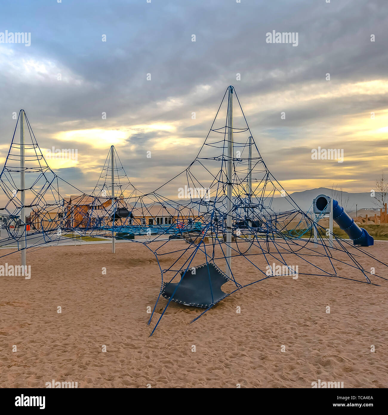 Frame Square Rope climbing frame and tunnels at a playground under ...