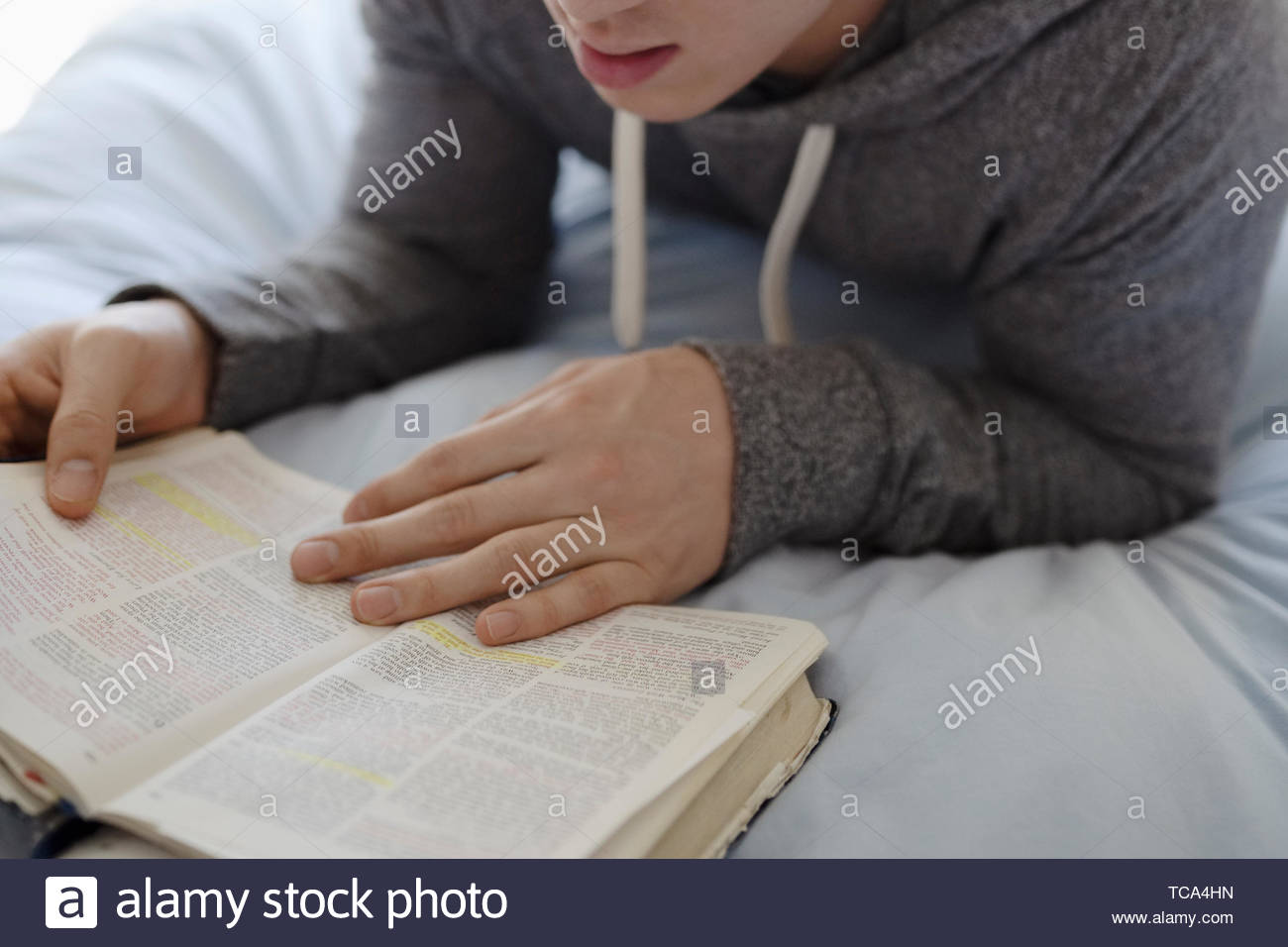 Person reading bible hi-res stock photography and images - Alamy