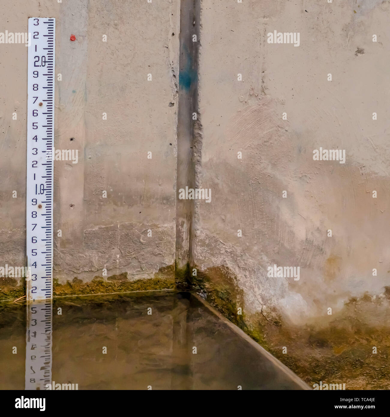 Frame Square Close up inside of a concrete water tank with clear water ...