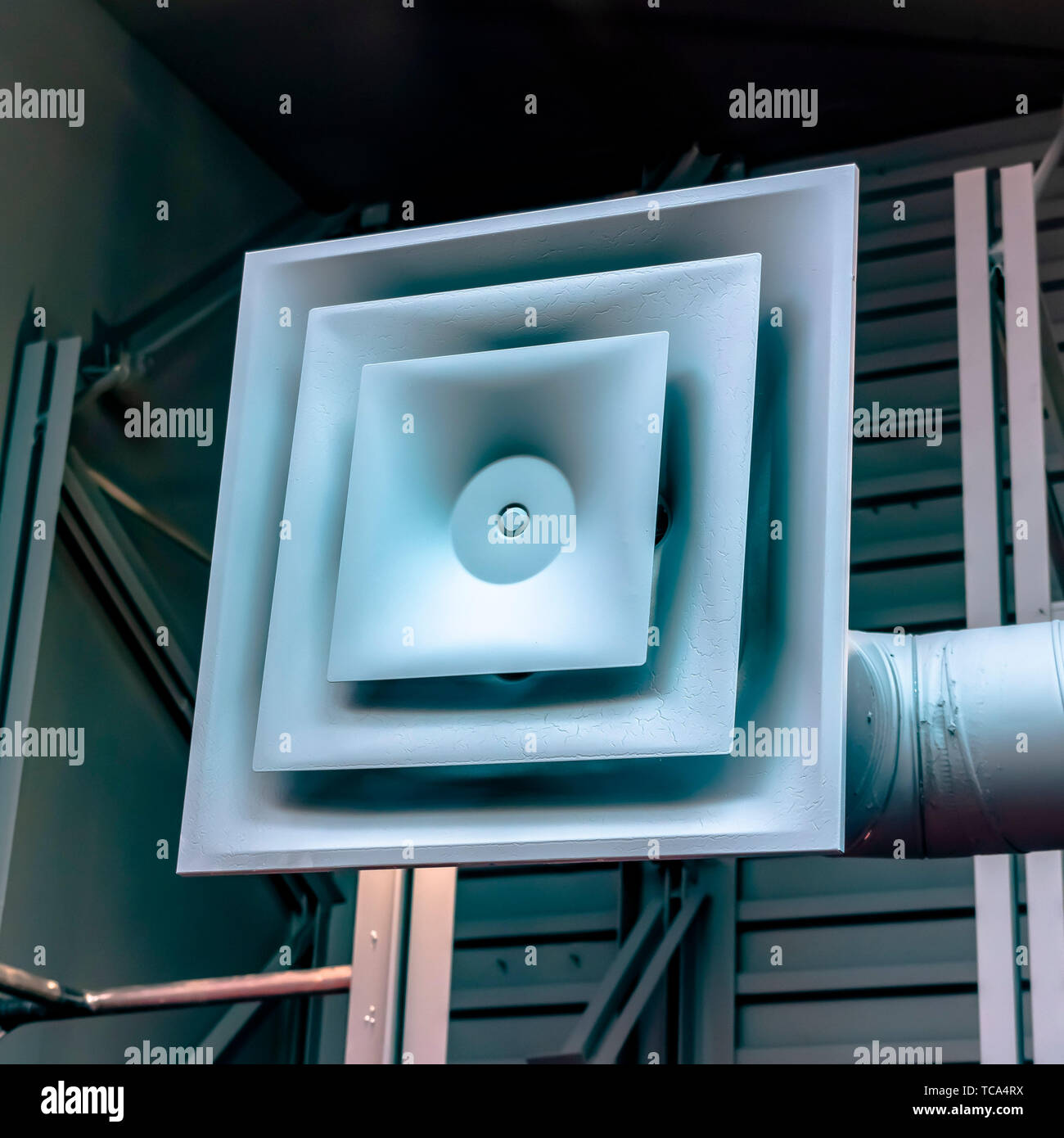 Square Close up view of a square air conditioner ventilator connected ...