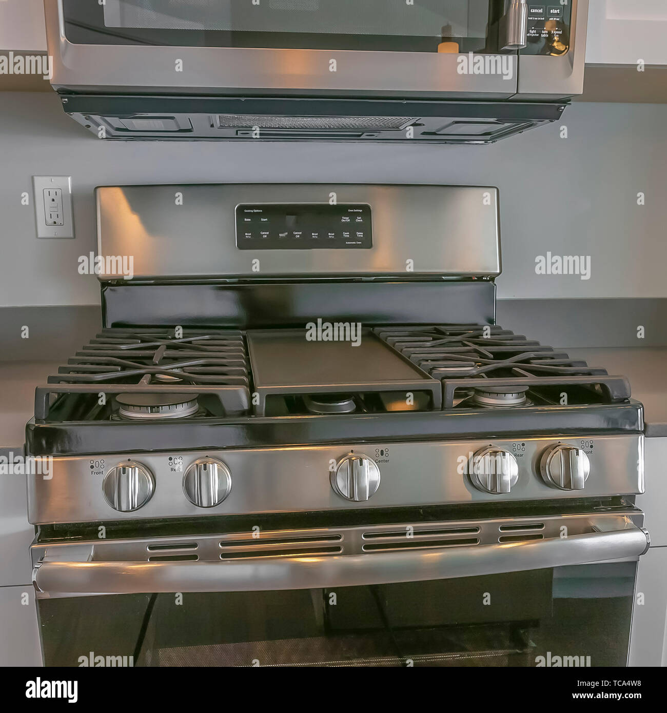 Square Close up of a range and microwave inside the modern kitchen of a ...