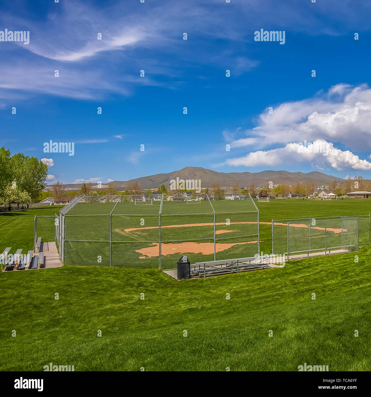 Square Baseball or Softball field with bleachers outside the safety ...