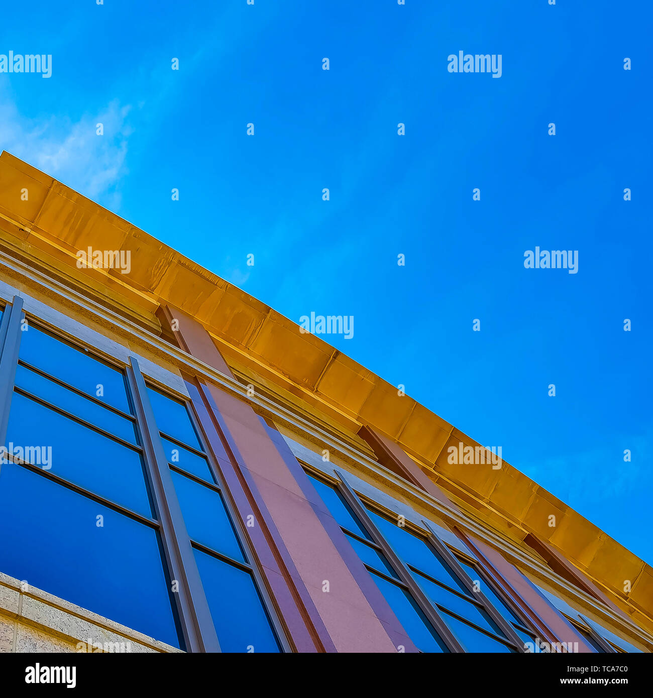 Frame Square Commercial building exterior with cylindrical wall lights ...