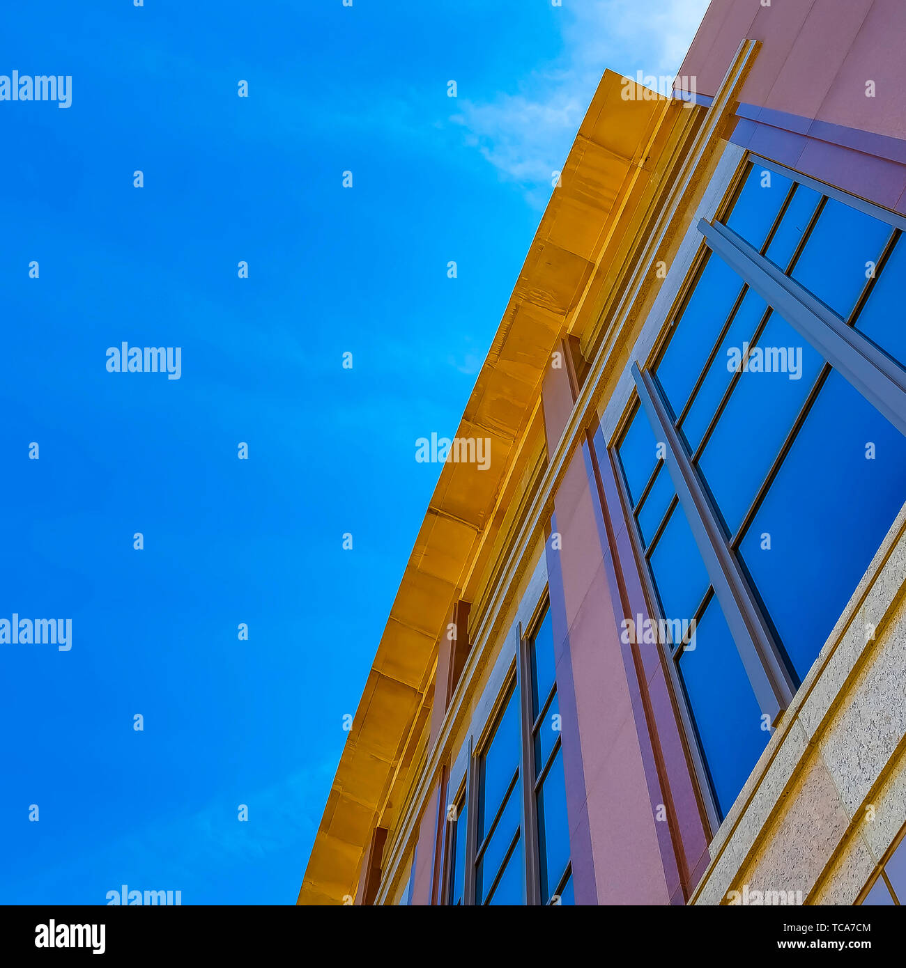 Square Commercial building exterior with cylindrical wall lights and ...