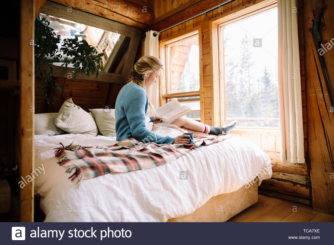 Reading on the bed hi-res stock photography and images - Alamy