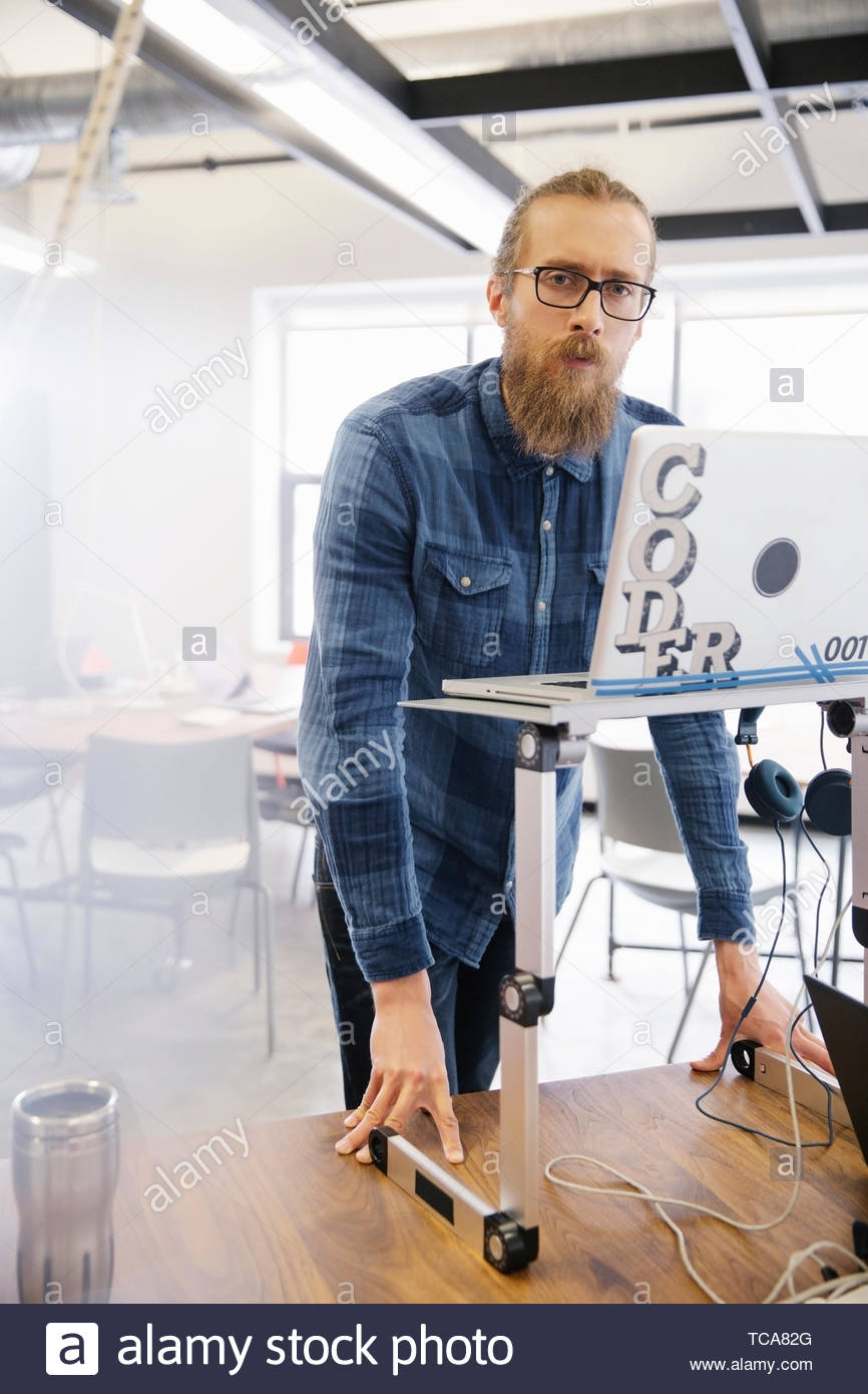 Businessman sitting desk laptop hi-res stock photography and images - Alamy