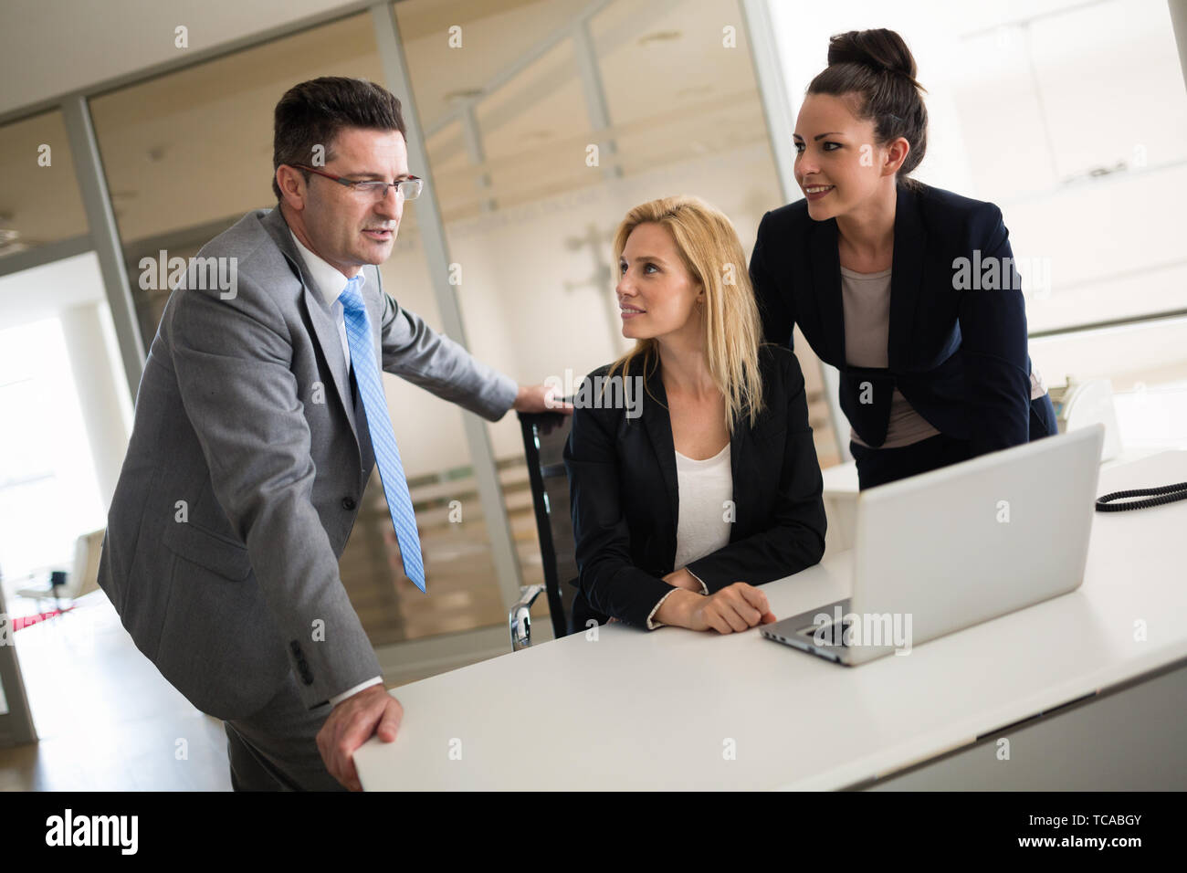 Portrait of a group of business people working together Stock Photo - Alamy