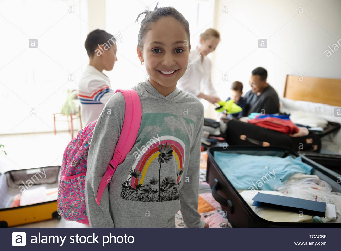Parents helping son to pack hi-res stock photography and images - Alamy