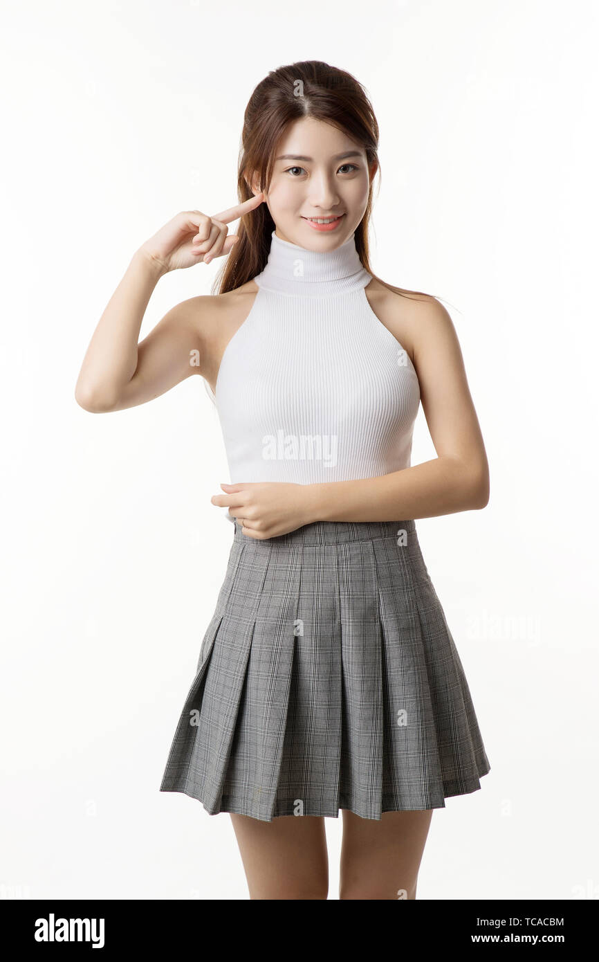 Beautiful cute college student against white background Stock Photo - Alamy