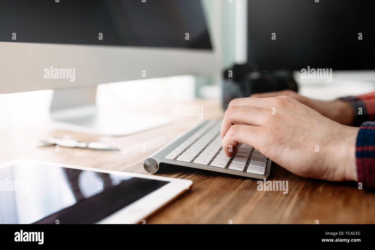 Man programming working on computer hi-res stock photography and images ...