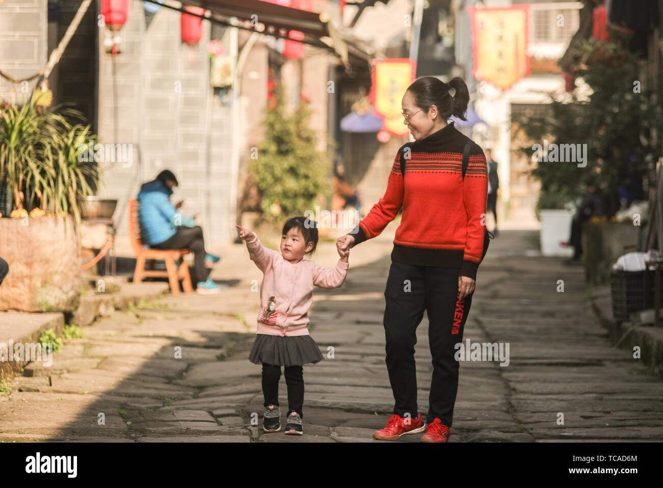Grandma and granddaughter go to the old street Stock Photo - Alamy