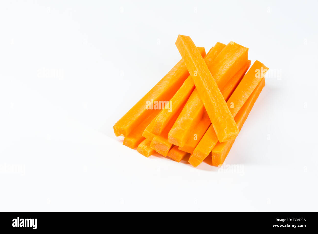 Red radish strips on white background Stock Photo - Alamy