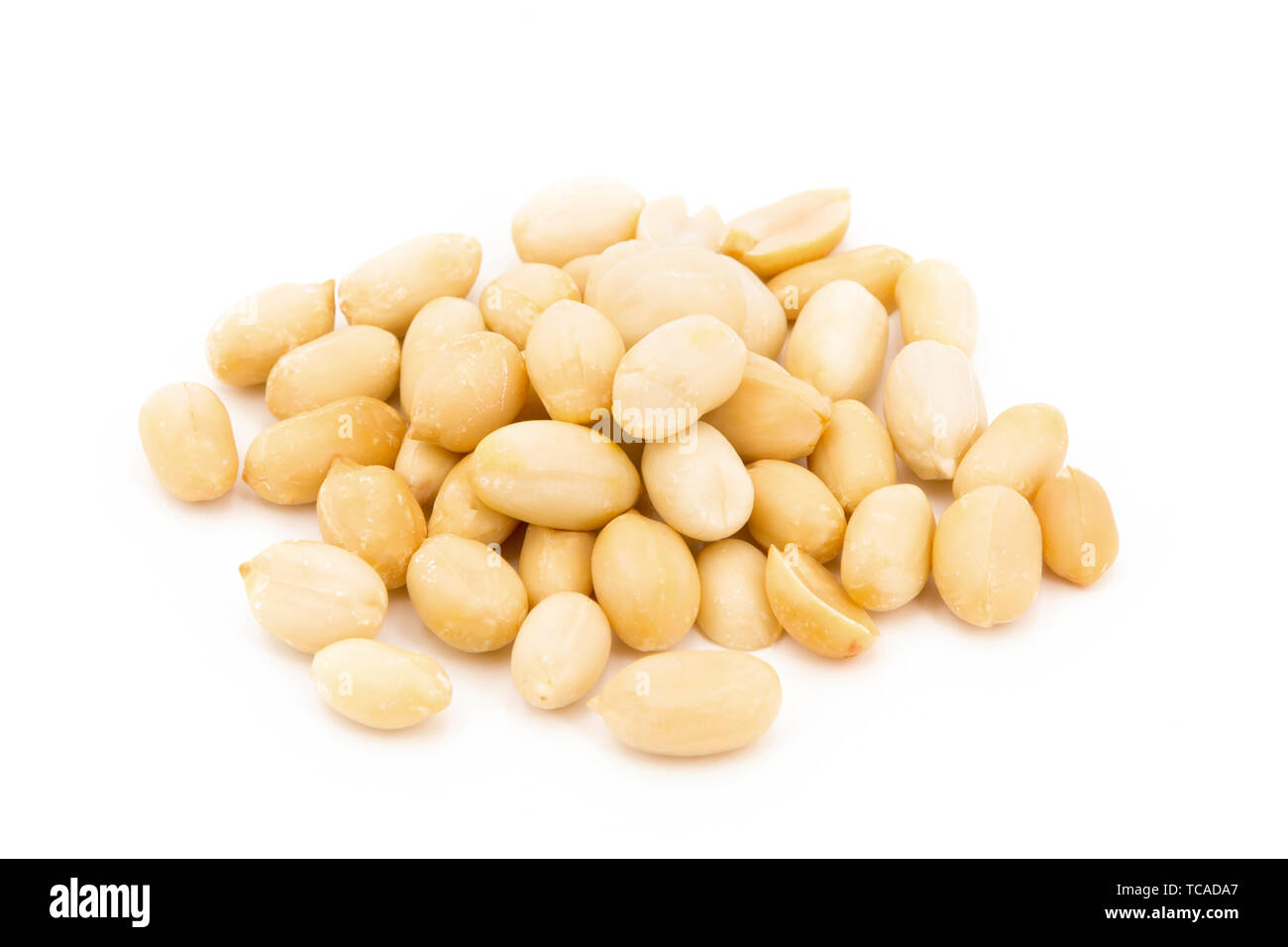 Peeling peanuts on white background Stock Photo - Alamy