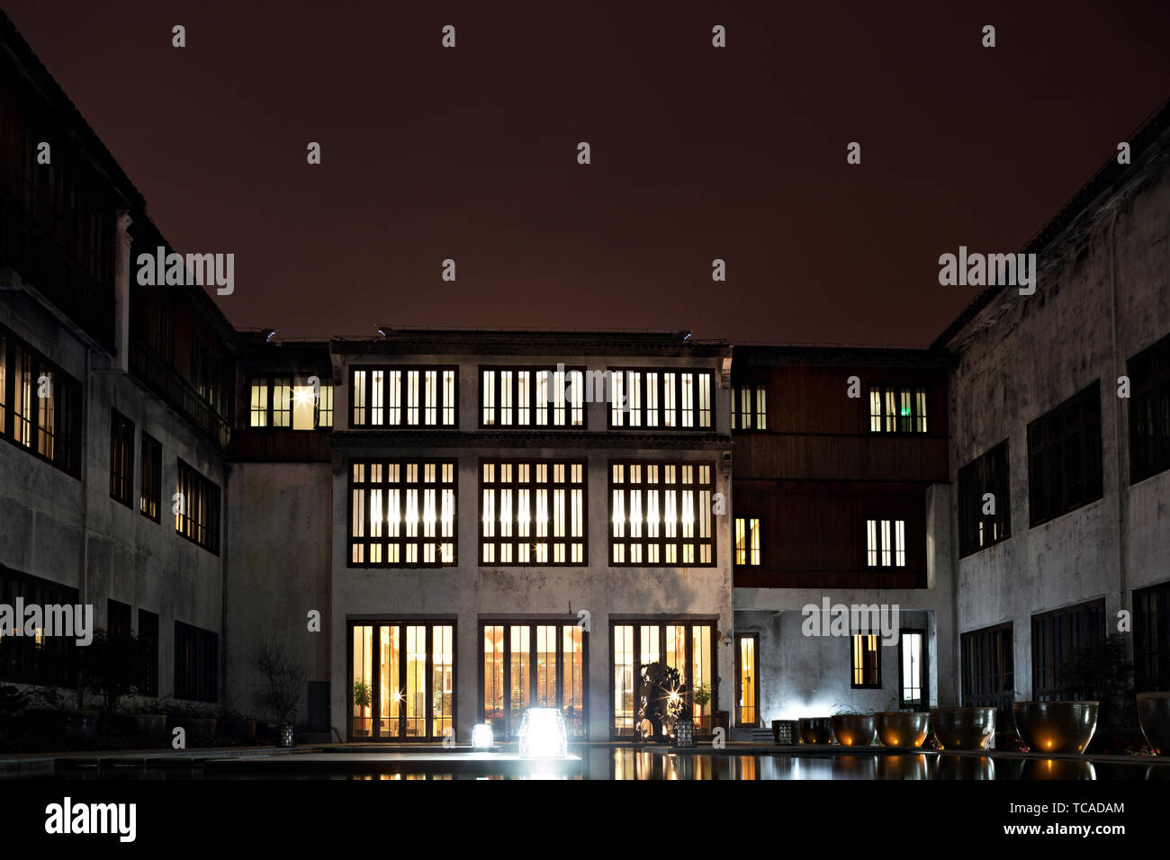 Night scene of traditional building near the river Stock Photo - Alamy