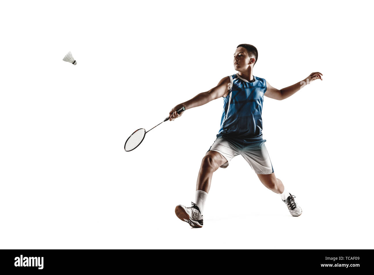 Little boy playing badminton isolated on white studio background. Young ...
