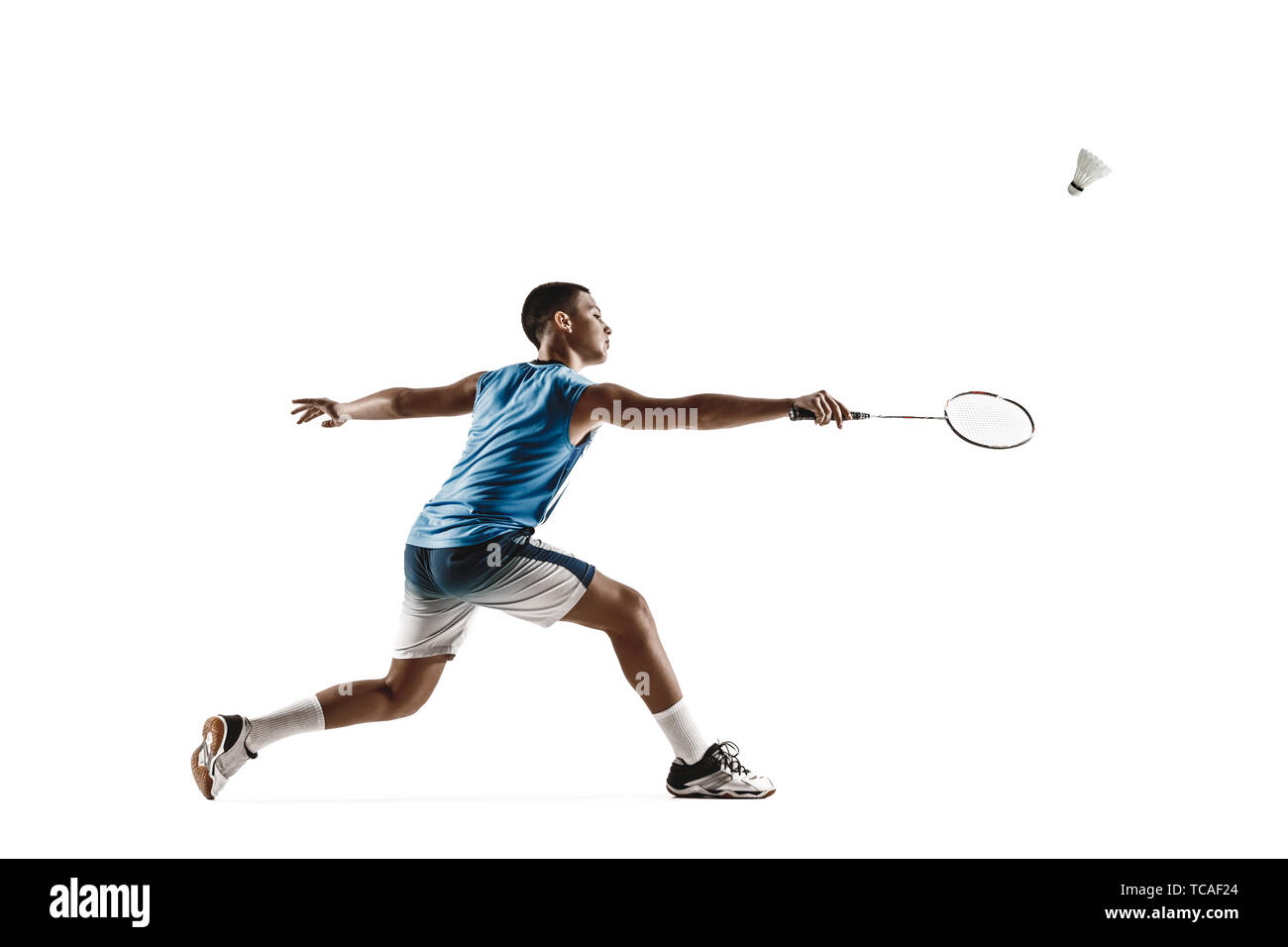Little boy playing badminton isolated on white studio background. Young ...