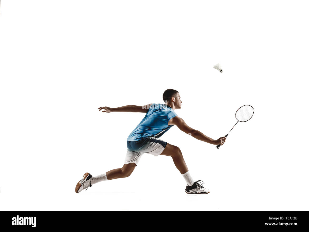 Little boy playing badminton isolated on white studio background. Young ...