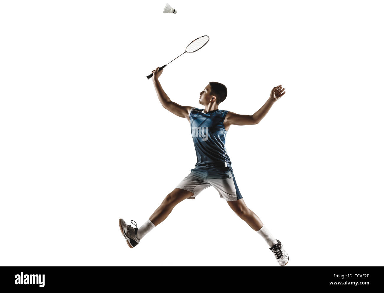 Little boy playing badminton isolated on white studio background. Young ...