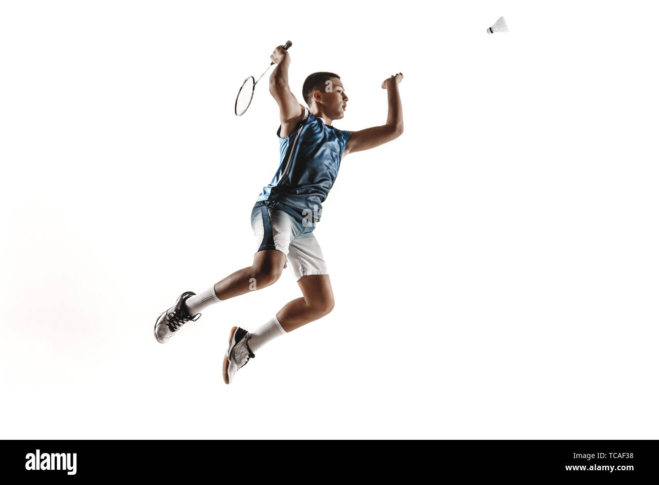 Little boy playing badminton isolated on white studio background. Young ...