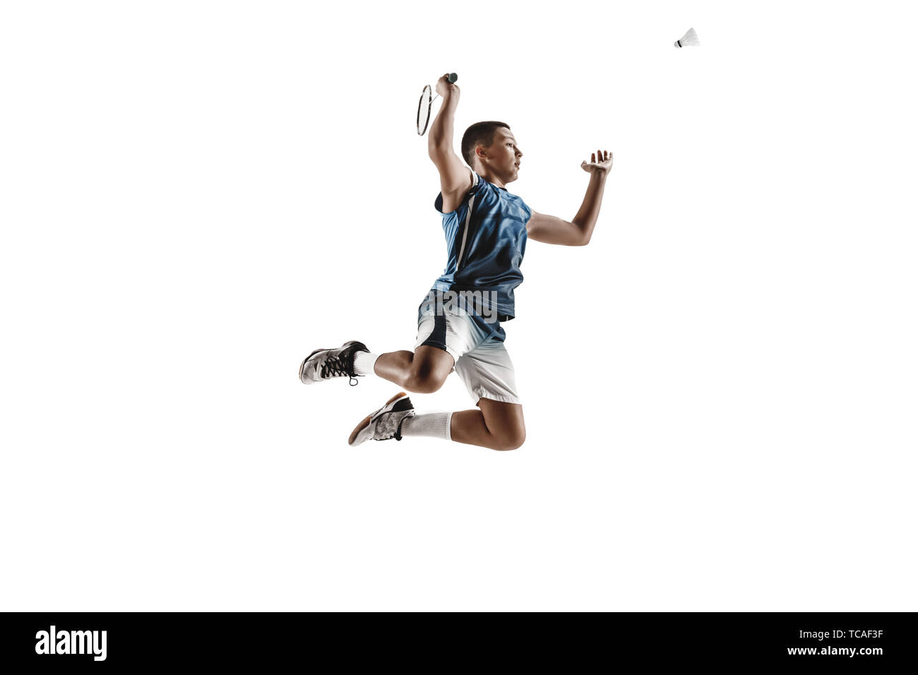 Little boy playing badminton isolated on white studio background. Young ...