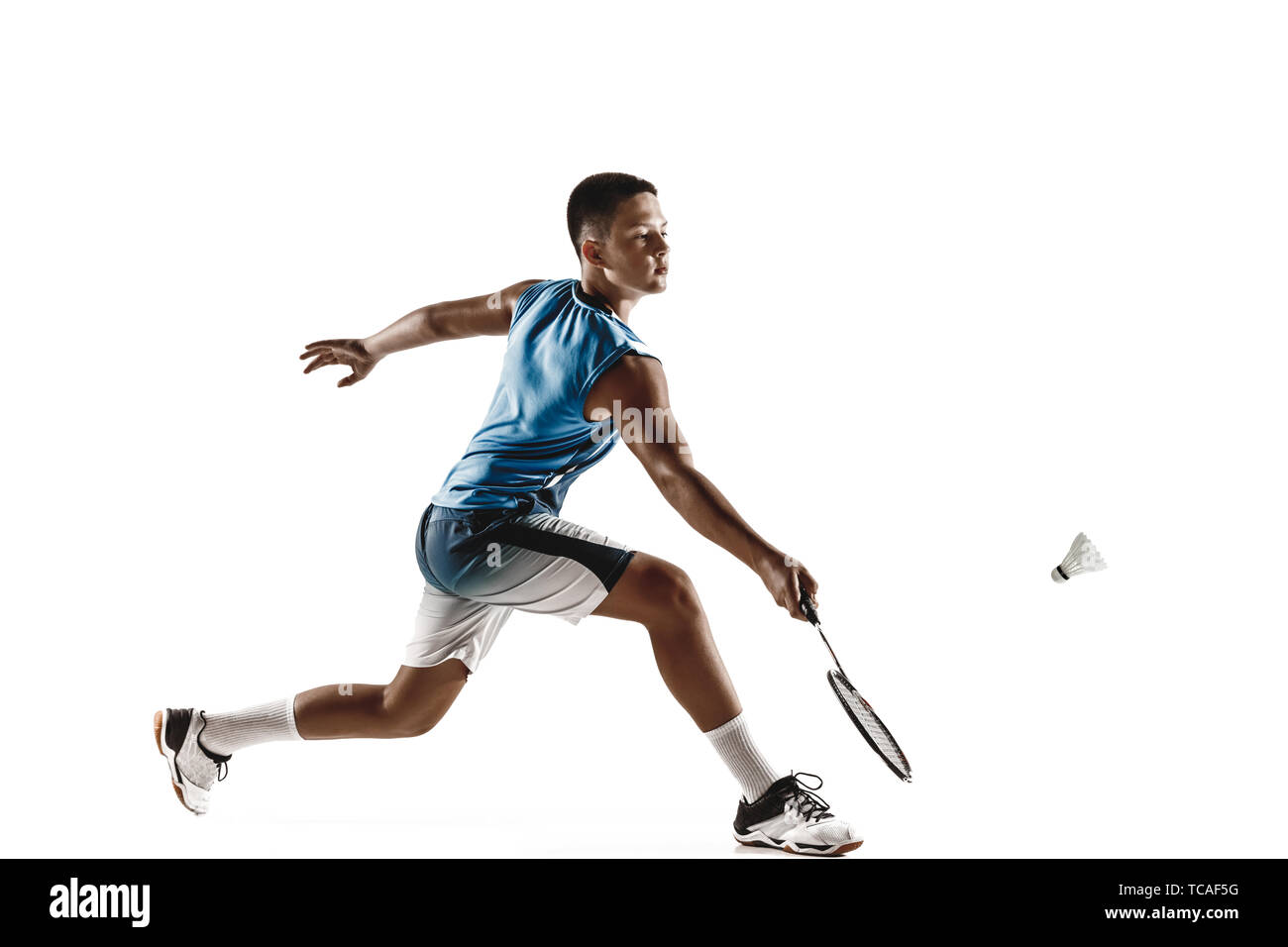 Little boy playing badminton isolated on white studio background. Young ...