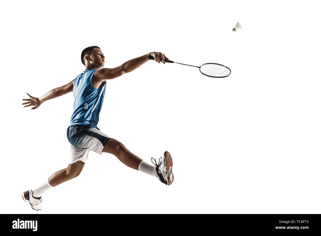 Little boy playing badminton isolated on white studio background. Young ...