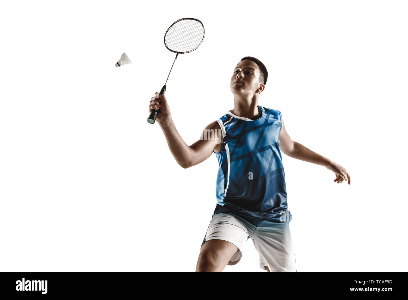 Little boy playing badminton isolated on white studio background. Young ...