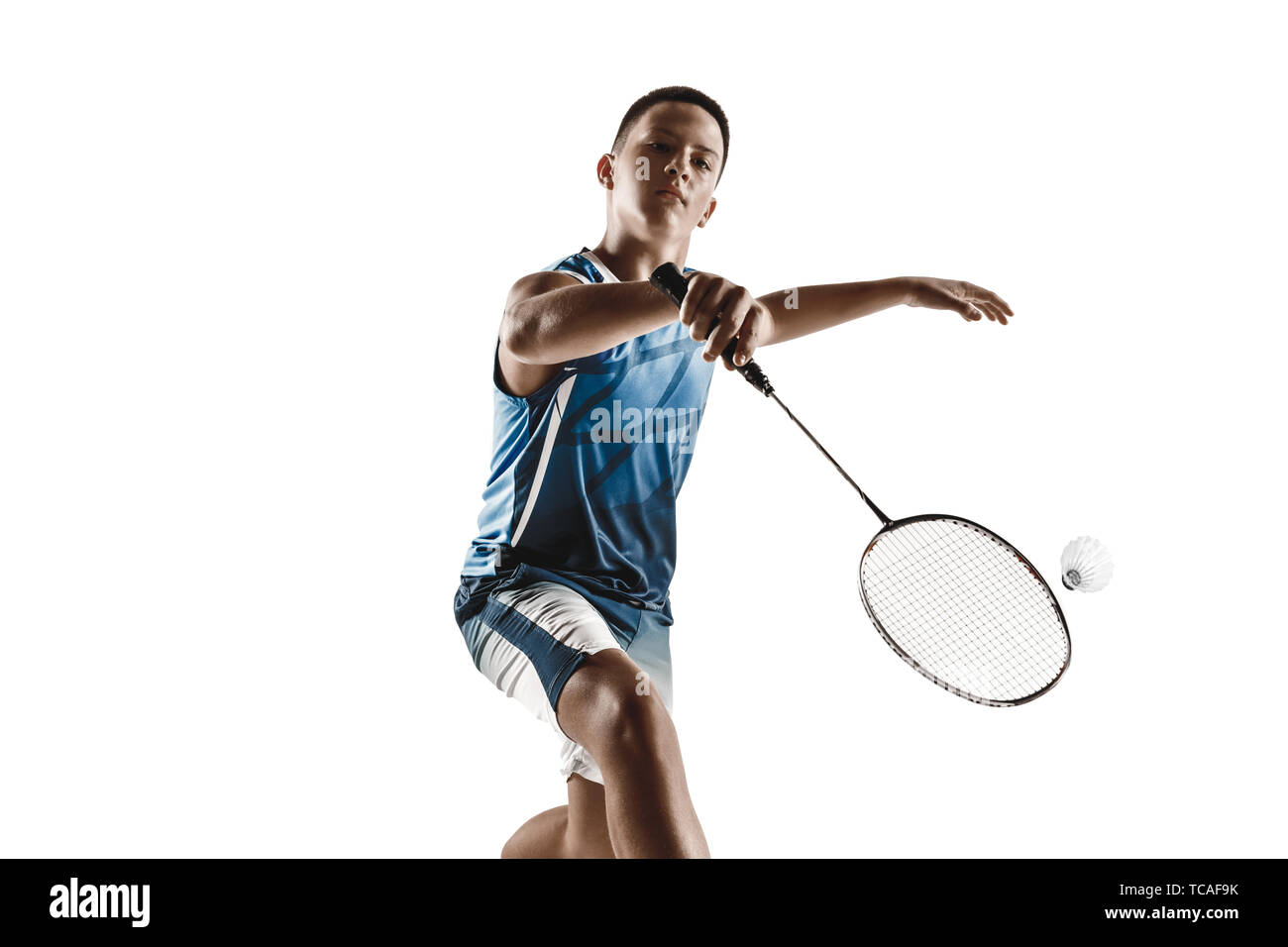 Little boy playing badminton isolated on white studio background. Young ...