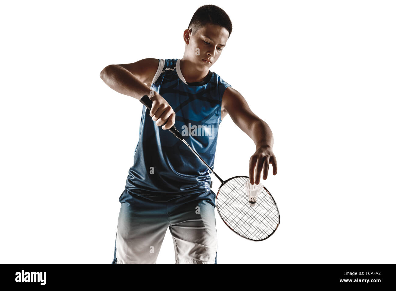 Little boy playing badminton isolated on white studio background. Young ...