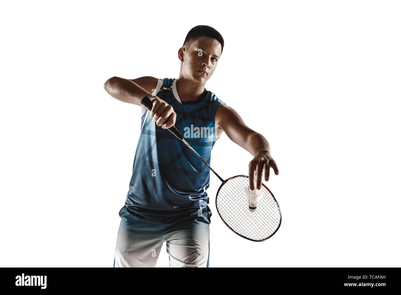 Little boy playing badminton isolated on white studio background. Young ...