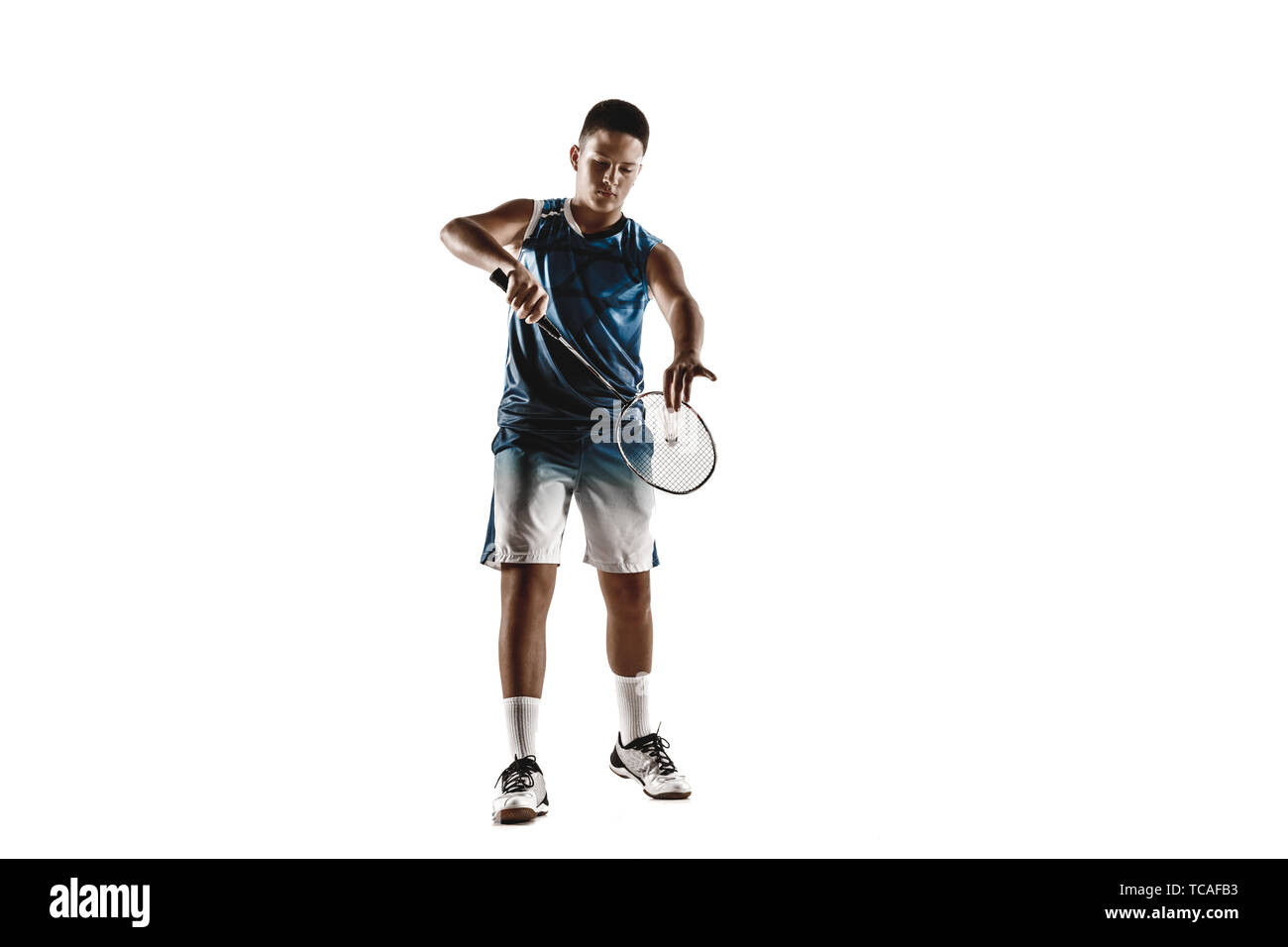 Little boy playing badminton isolated on white studio background. Young ...