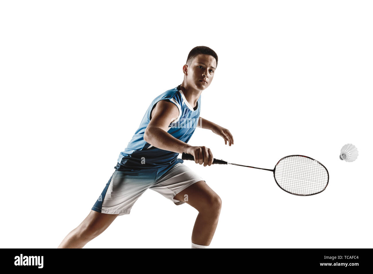Little boy playing badminton isolated on white studio background. Young ...